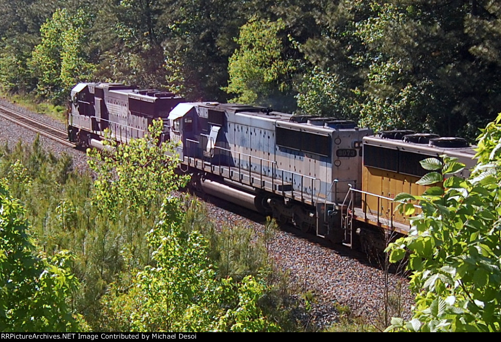 GMTX SD-60 #9073 (ex Oakway) is mid consist on this westbound on the bypass